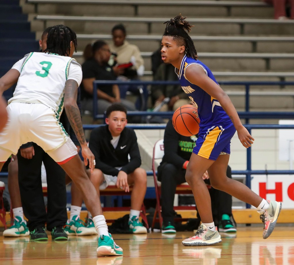 Booker T. Washington's Odis Carter drives team in district.